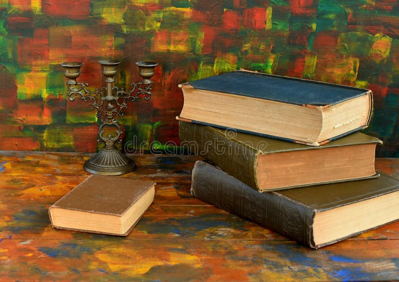 Still Life - Bronze Candlestick and Old Books.Old Wooden Table Stock ...