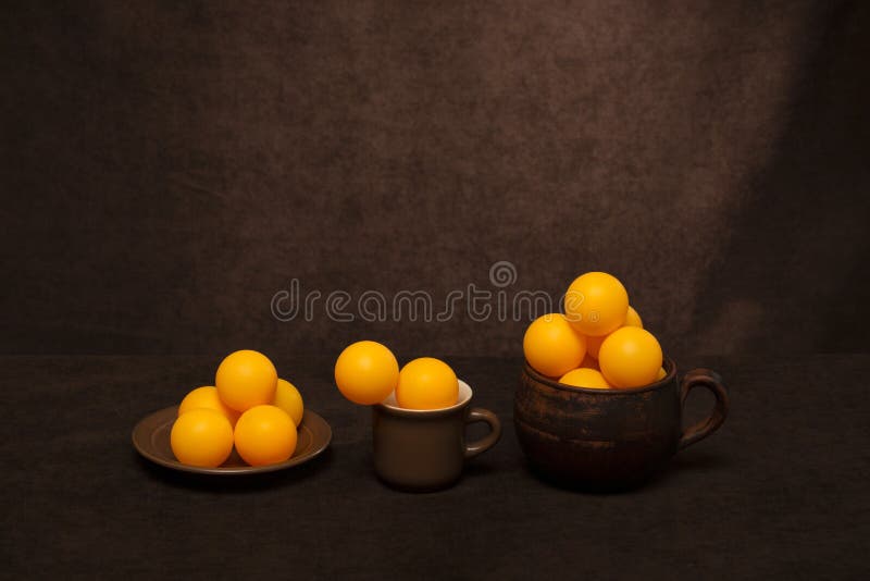 Still Life with Brown Cups and Orange Balls Stock Photo - Image of ...