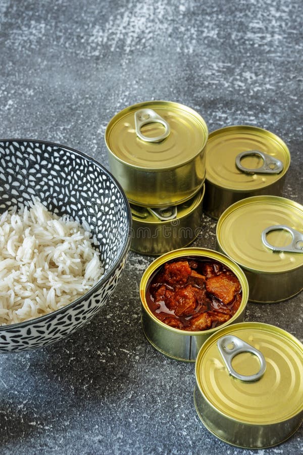 Still Life of Circular Cans with One of Them Open Full of Squid Next To ...