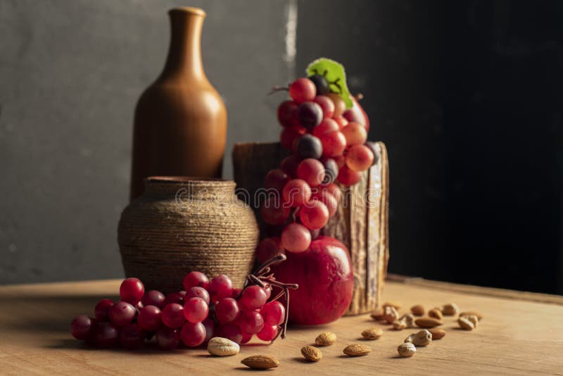 Still Life with a Clay Pot and Grapes and an Apple Stock Photo - Image ...