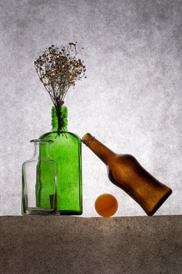 Still Life with Colored Bottles and a Dried Plant Twigs Stock Image ...
