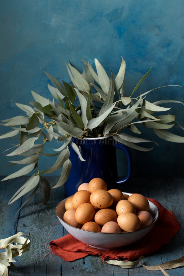 Still Life with Eggs in a Bowl on a Blue Background Stock Image - Image ...