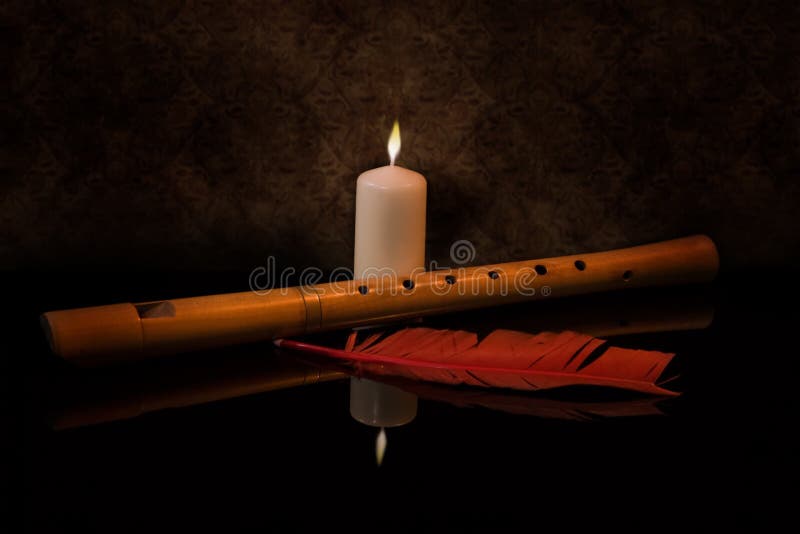 Still Life with Flute, Candle and Red Feather Stock Photo - Image of ...