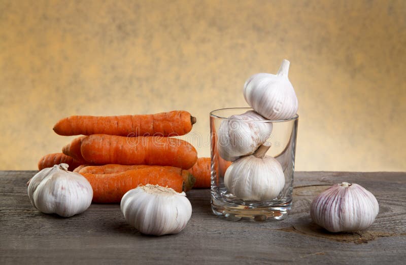 Still-life with Garlic and a Glass on Table Stock Photo - Image of ...