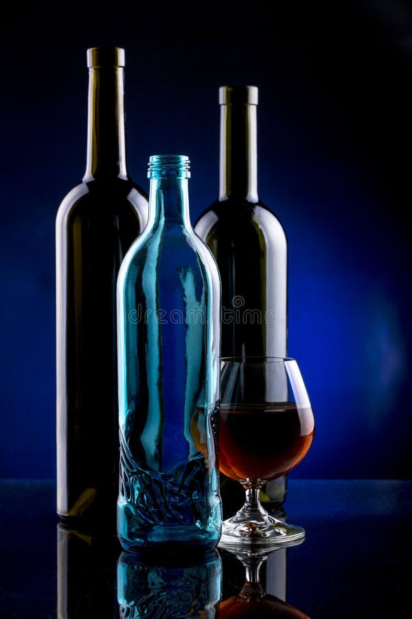 Still Life with Glass Bottles and Glass Stock Photo - Image of position ...
