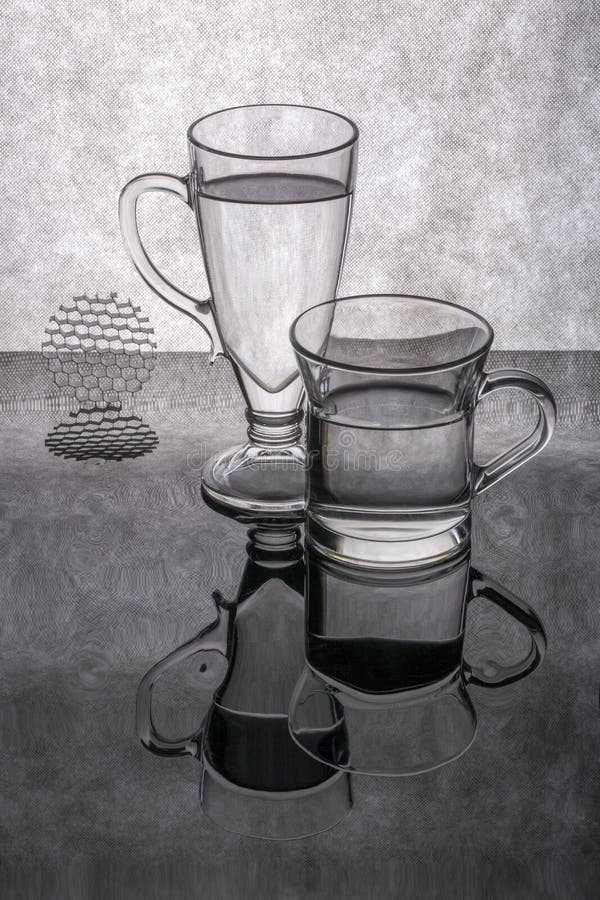 Still Life with Glass Cups with Liquid on a Gray Background Stock Photo ...