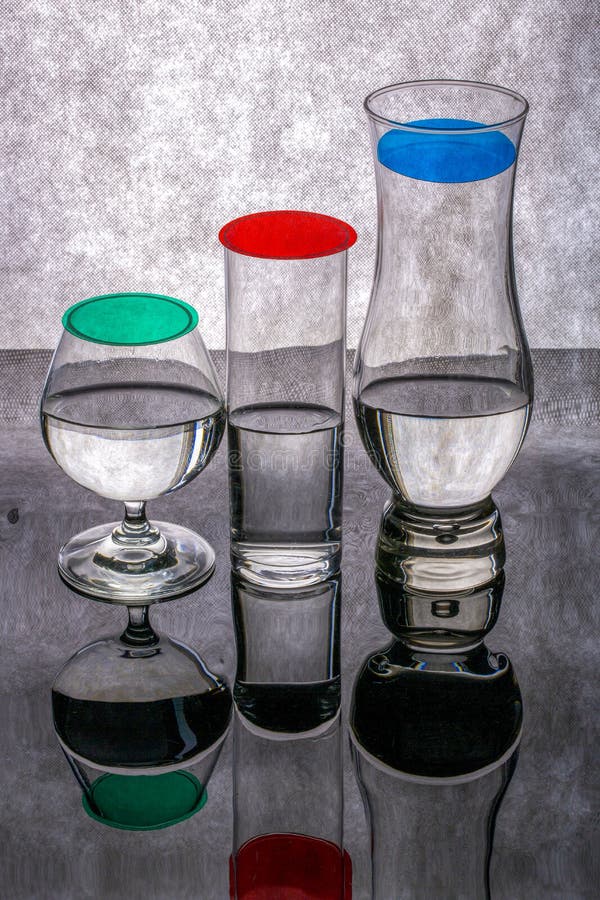Still Life with Glass Goblets with Reflection on a Gray Background ...