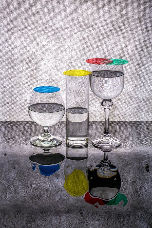 Still Life with Glass Goblets on a Reflective Surface Stock Photo ...