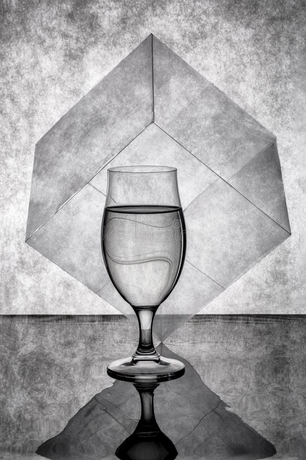 Still Life with a Glass of Liquid and a Cube Stock Image - Image of ...