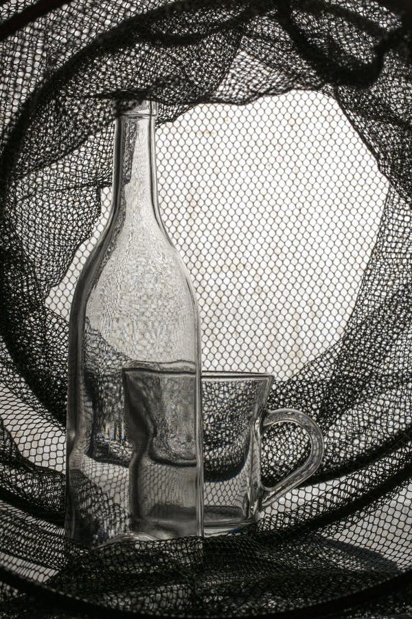 Still Life with Glass Objects on a Grid Background Stock Image - Image ...