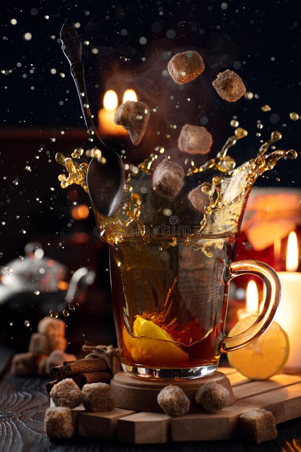 Still Life with a Glass of Tea Falling into a Glass with Sugar Cubes ...