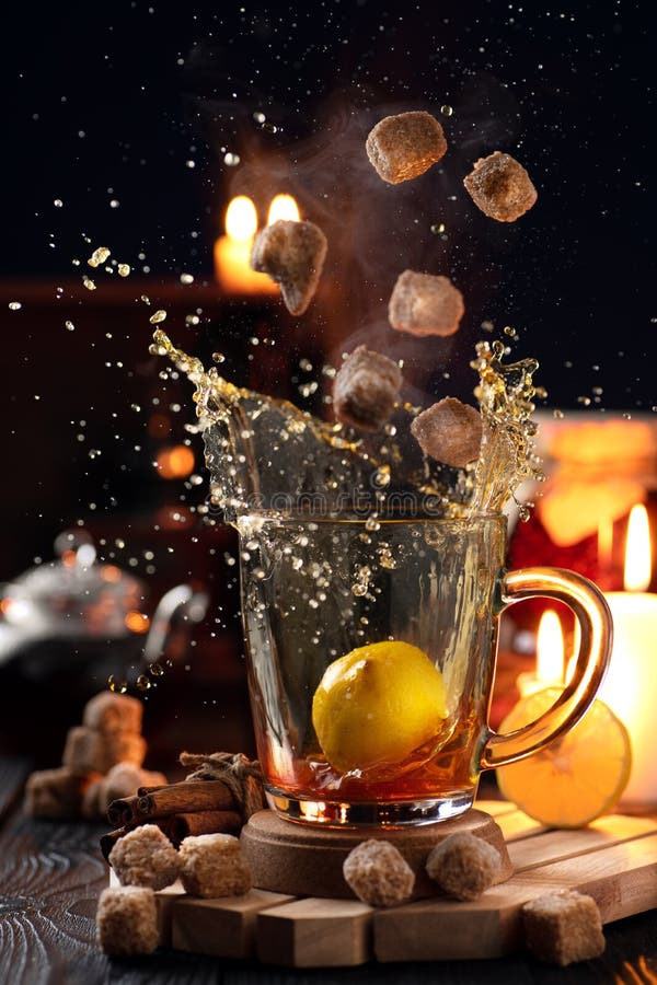 Still Life with a Glass of Tea Falling into a Glass with Sugar Cubes ...