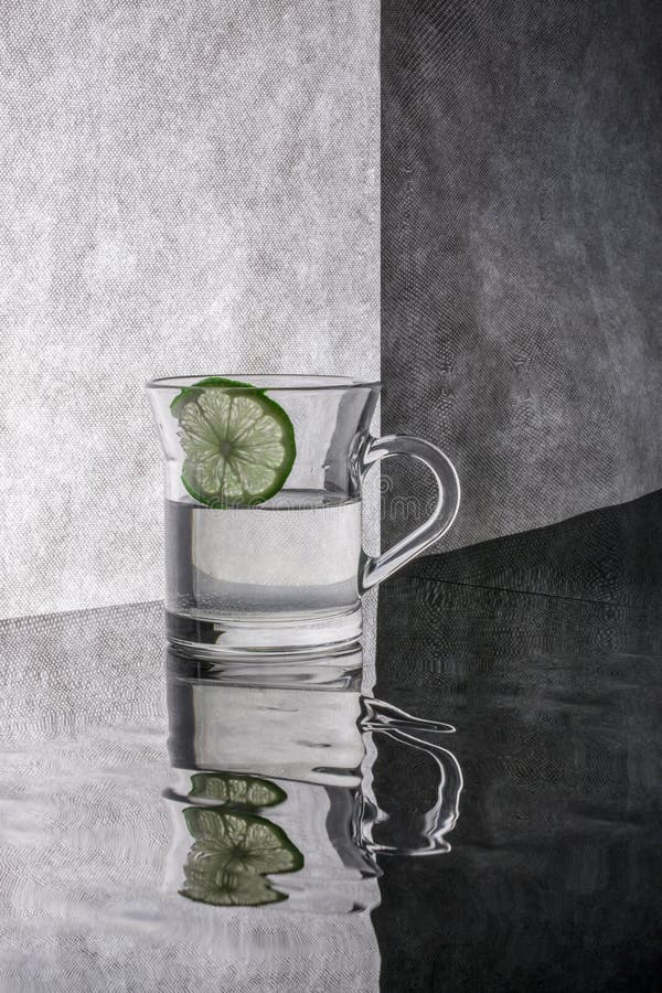 Still Life with a Glass of Water and a Slice of Lime Stock Photo ...