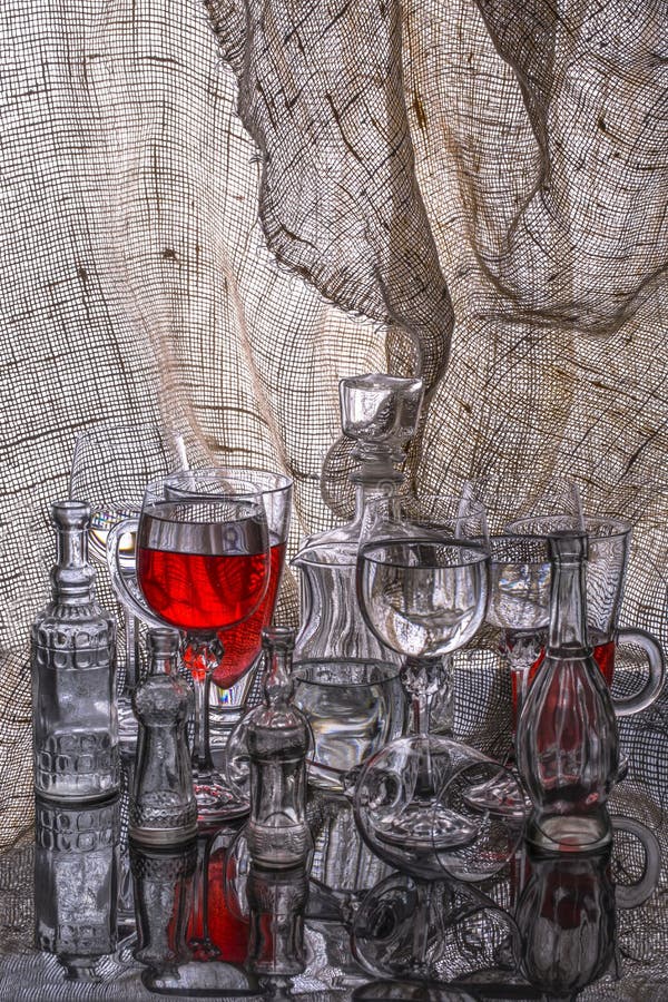 Still Life with Glasses with Liquid on the Reflective Surface Stock ...