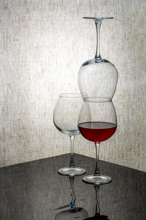 Still Life with Glasses on a Reflective Surface Stock Image - Image of ...