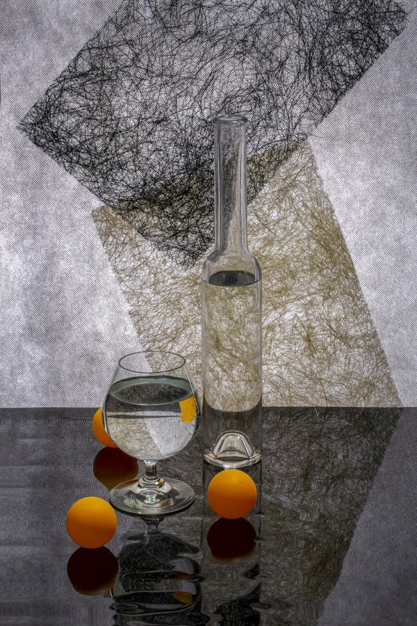 Still Life with Glassware and Orange Balls Stock Photo - Image of glass ...