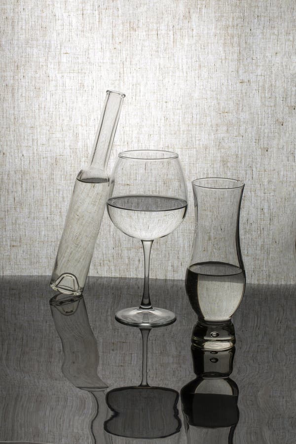 Still Life with Glassware on a Reflective Surface Stock Photo - Image ...