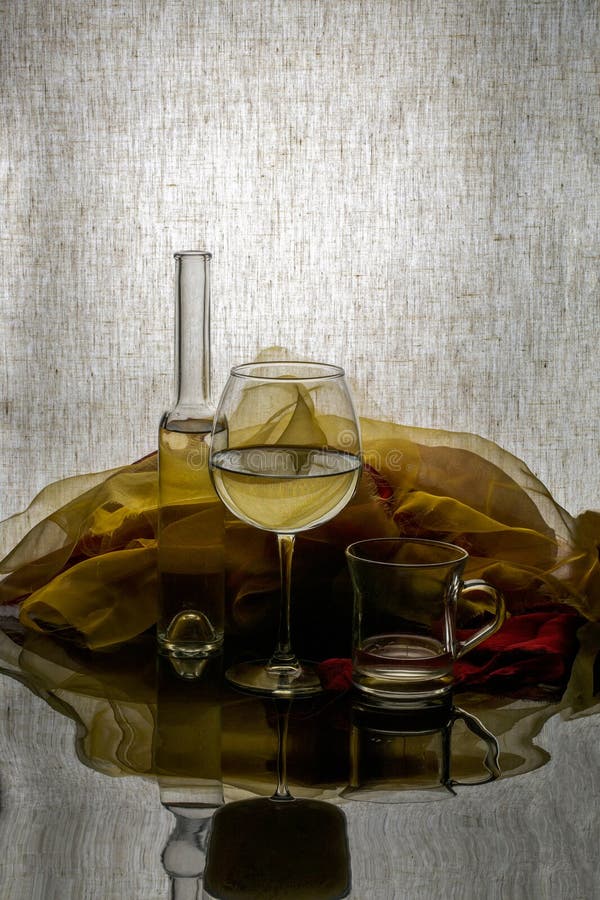 Still Life with Glassware on a Reflective Surface with Fabric Stock ...