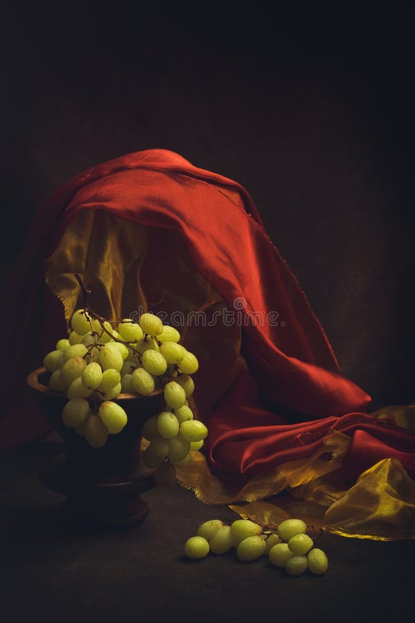 Still Life with Grapes, Yellow and Red Fabric Stock Photo - Image of ...