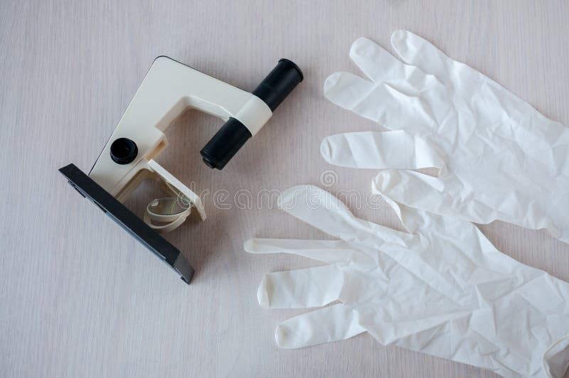 Still Life : Microscope and Disposable Gloves on the Table Stock Image ...