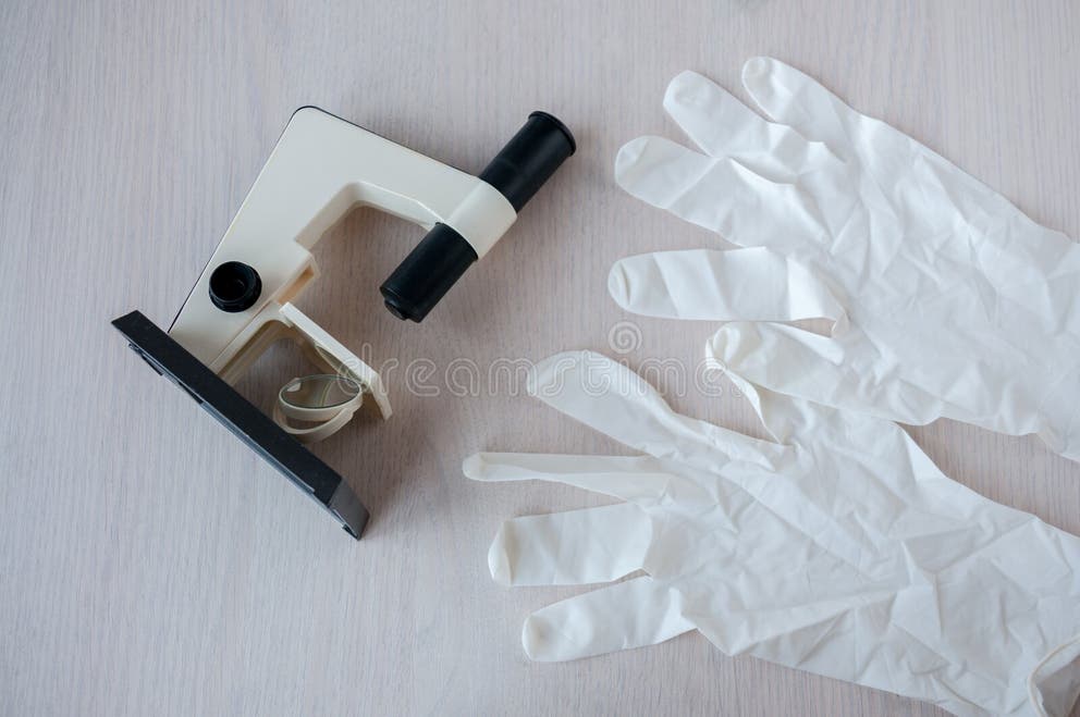 Still Life : Microscope and Disposable Gloves on the Table Stock Image ...