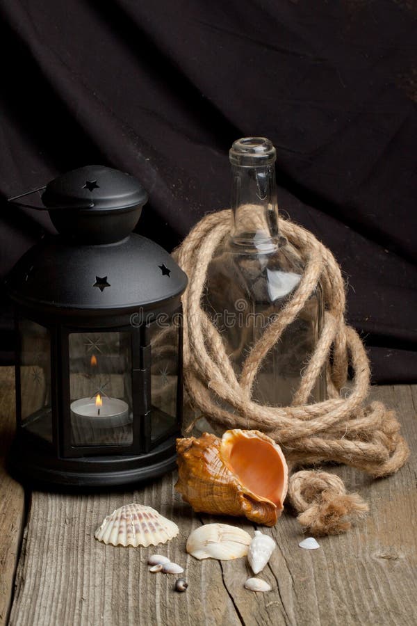 Still-life with Old Lantern, Bottle and Sea Shells Stock Photo - Image ...