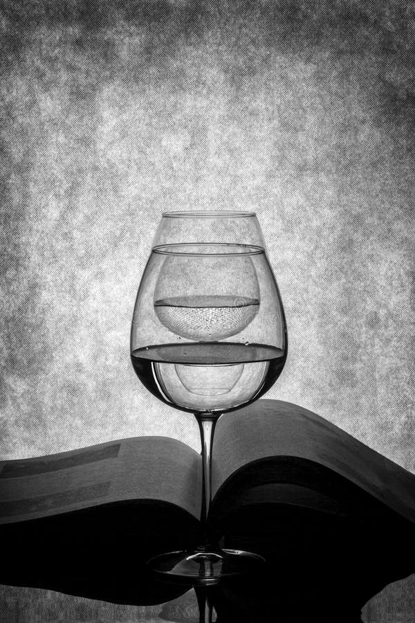 Still Life with an Open Book and Glasses with Liquid Stock Photo ...