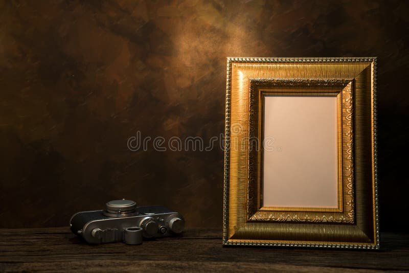 Still Life of Picture Frame on Table with Vintage Camera Stock Photo ...