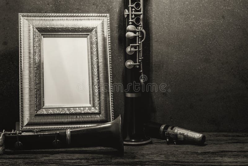 Still Life of Picture Frame on Wooden Table with Clarinet Stock Image ...