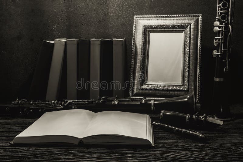 Still Life of Picture Frame on Wooden Table with Clarinet Stock Photo ...