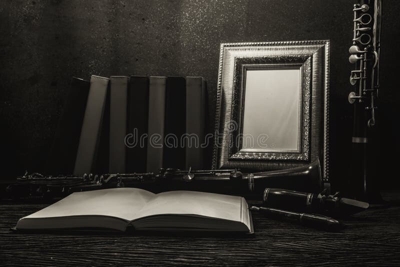 Still Life of Picture Frame on Wooden Table with Clarinet Stock Photo ...