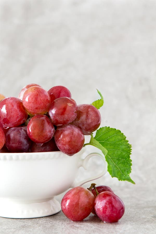 Still Life with Red Grapes in White Vintage Cup Stock Photo - Image of ...
