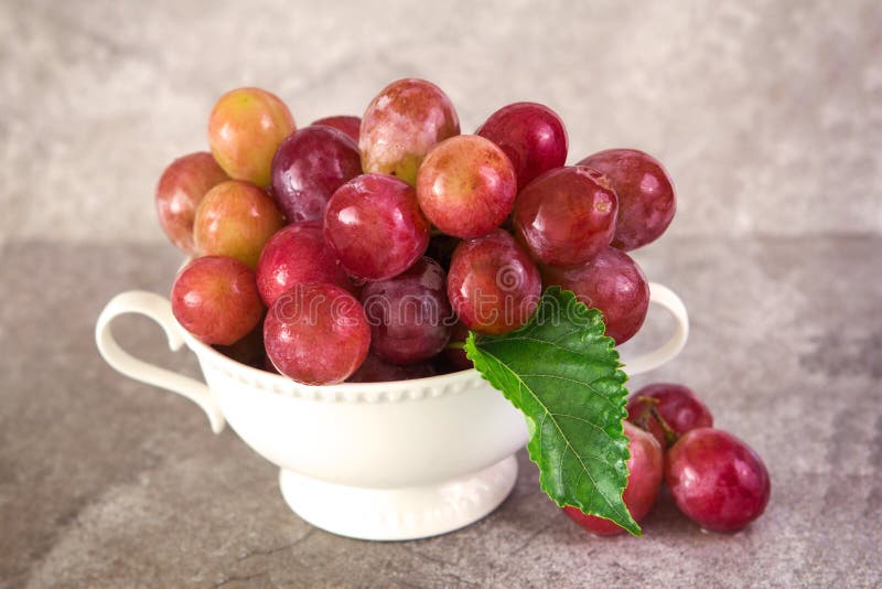 Still Life with Red Grapes in White Vintage Cup , Selective Foc Stock ...