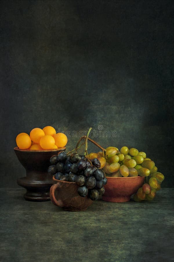 Still Life with Ripe Grapes and Orange Balls Stock Photo - Image of ...
