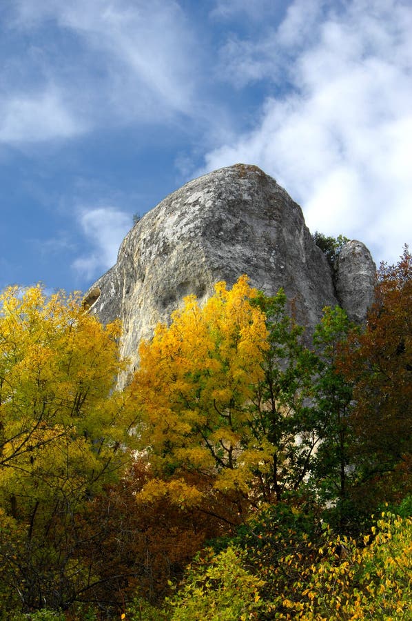 Still Life with Rock, Colored Trees and Blue Sky Stock Image - Image of ...