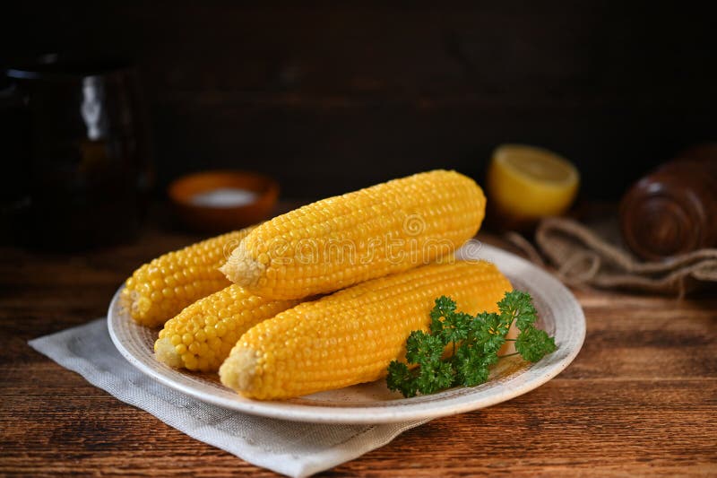 Still Life in a Rustic Style with Boiled Corn on a Plate Stock Image ...