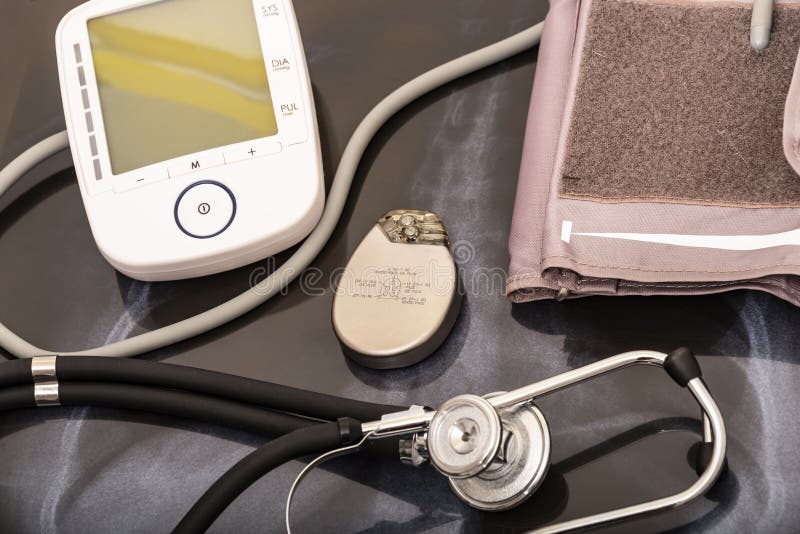 Still Life of a Stethoscope with Pacemaker Battery and Heart Pressure ...