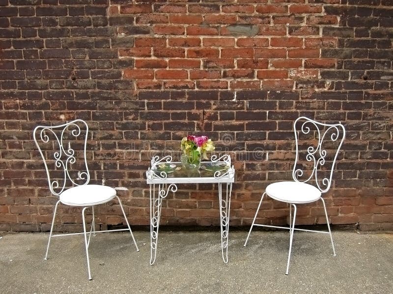 Still Life Table and Chairs Brick Wall Stock Photo - Image of inviting ...