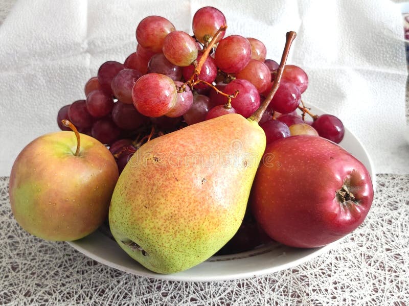Still Life of Three Fruits, Grapes, Apples and Pears in Daylight Stock ...