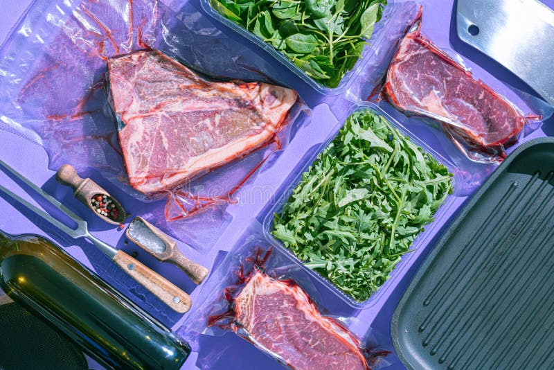 Still Life of Vacuum-packed Meat with Herbs and Butcher`s Tools Stock ...