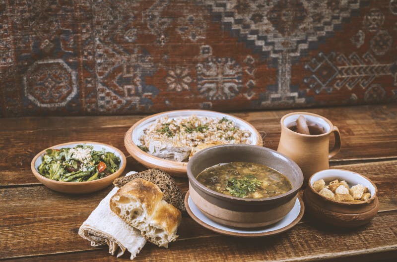 Middle Eastern Cuisine Dishes in Ceramic Plates on a Wooden Table ...