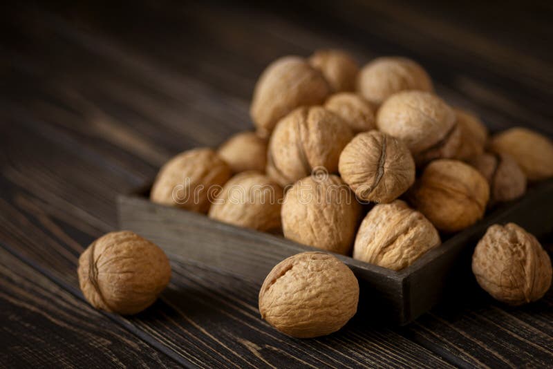 Still Life of Walnuts Lying on a Dark Wooden Table Stock Photo - Image ...