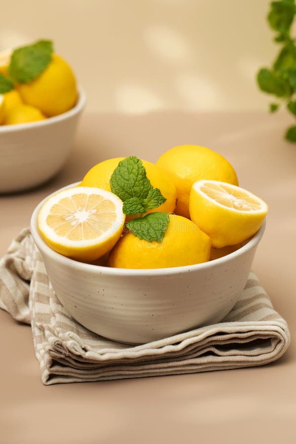 Still Life Yellow Ripe Lemons in a Ceramic Plate with a Sprig of Mint ...