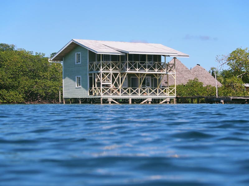Tropical stilt restaurant stock image. Image of pier - 21905445