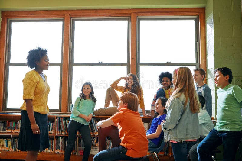 Stimulating Young Minds. a Young Teacher Educating a Group of ...