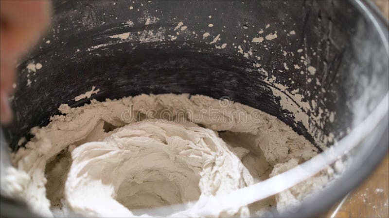 Stir the Building Mix in a Bucket. Stirs the Solution in a Bucket Stock ...