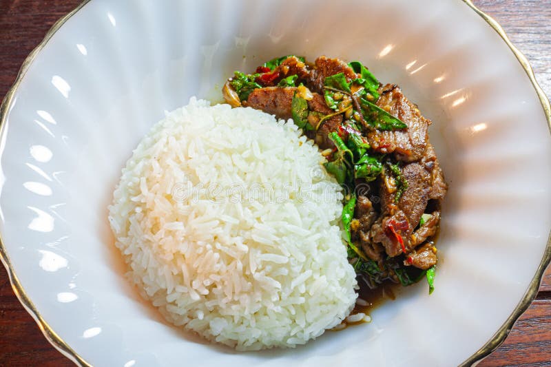 Stir Fried Basil with Beef on Rice Stock Image - Image of bowl, cooked ...