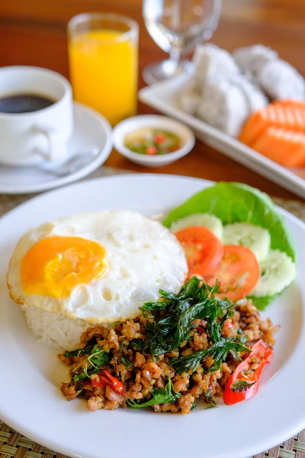 Stir Fried Basil with Pork and a Fried Egg on the Table Stock Image ...