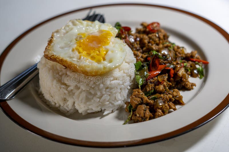 Stir-fried Basil with Pork and Fried Egg Stock Photo - Image of ...