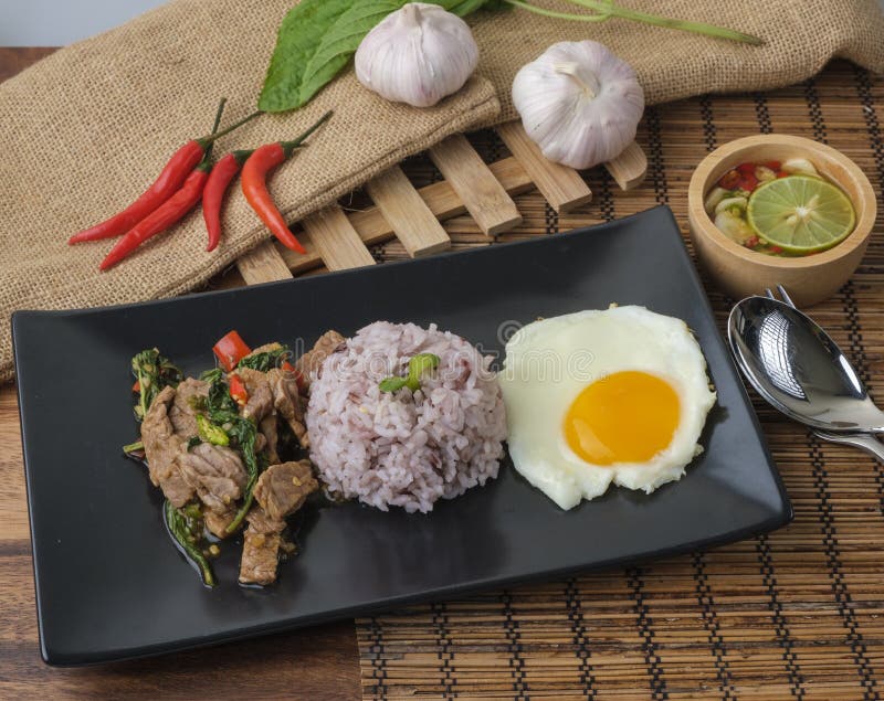 Stir-fried Beef Basil with Fried Egg and Riceberry Rice Stock Photo ...